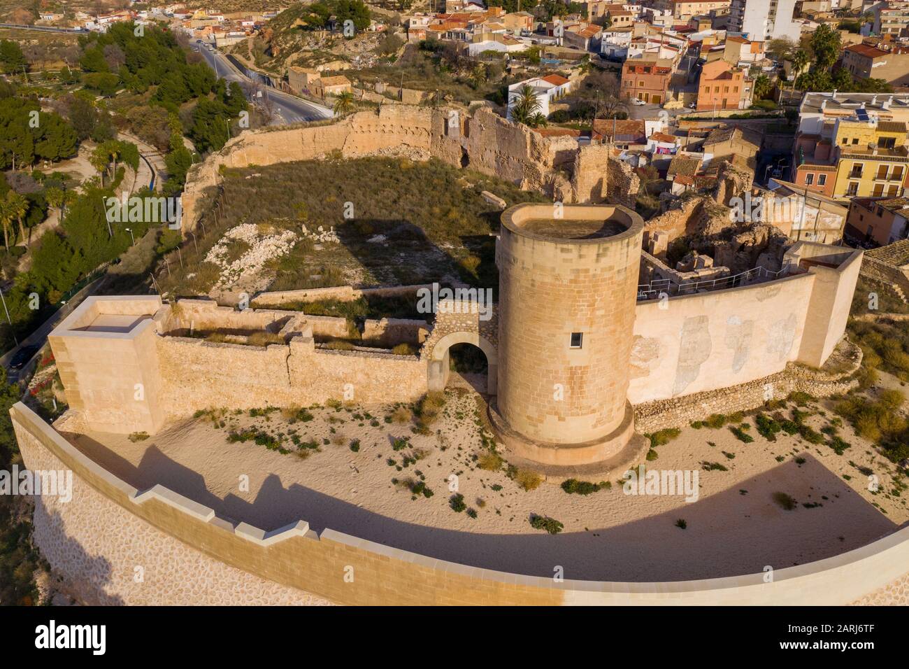 Aerial panoramic view of medieval Elda castle above the town with ...