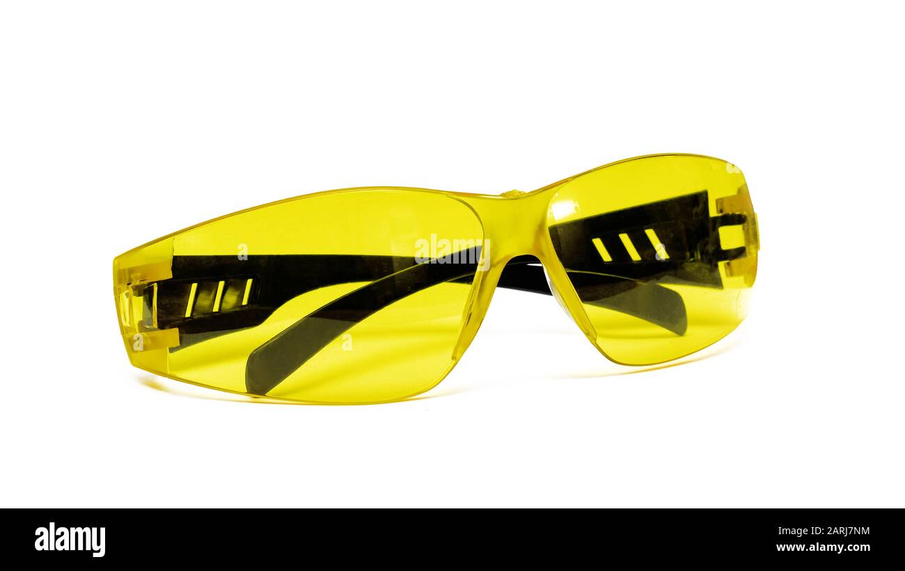 Yellow safety glasses close up, isolated on a white background Stock ...