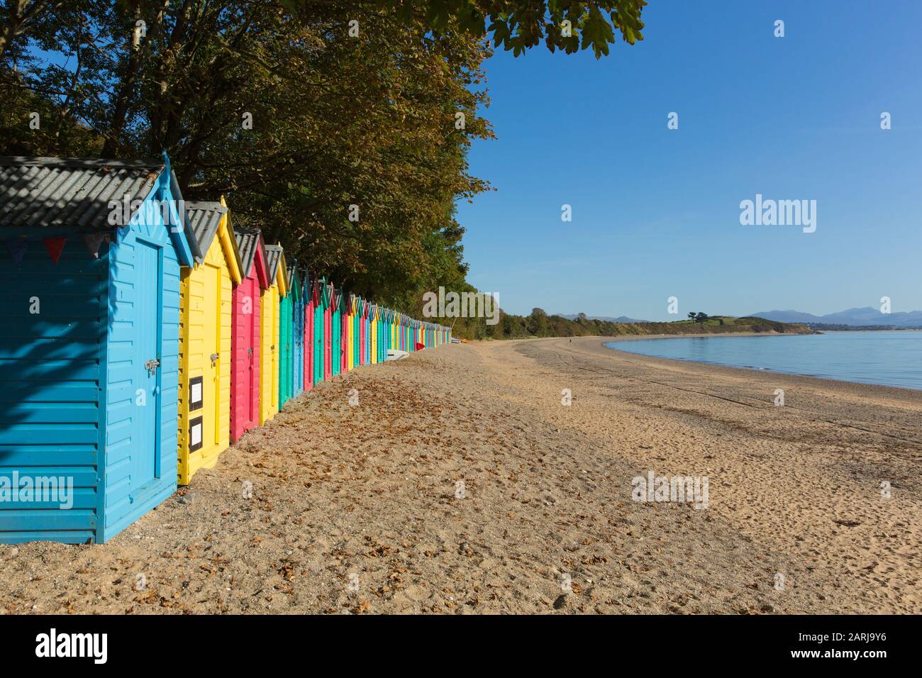 Colourful beach huts Llanbedrog the Llyn peninsula Wales between ...