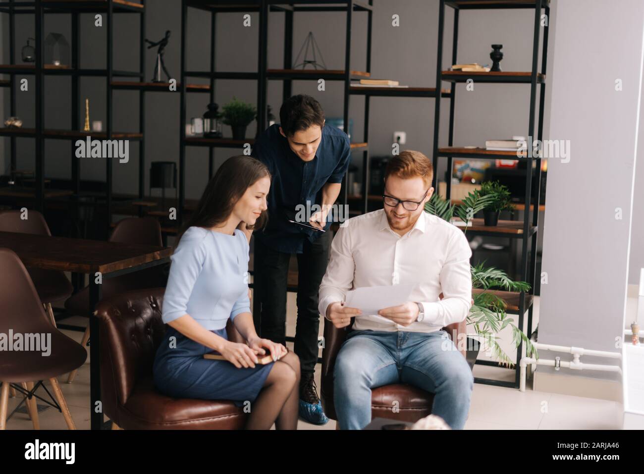 Business team coworkers talking at work, discussing new project ideas ...