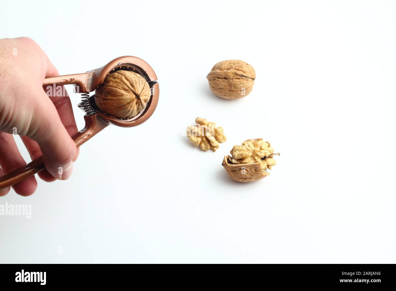 Walnut crack hand hi-res stock photography and images - Alamy