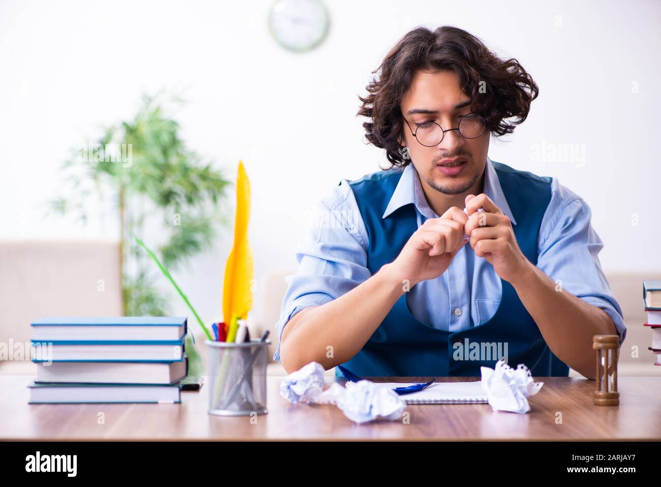 The young writer working on his new work Stock Photo - Alamy