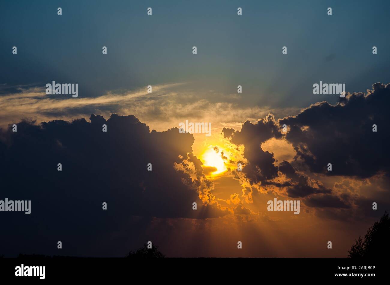 Sunset / sunrise with clouds, light rays and other atmospheric effect ...