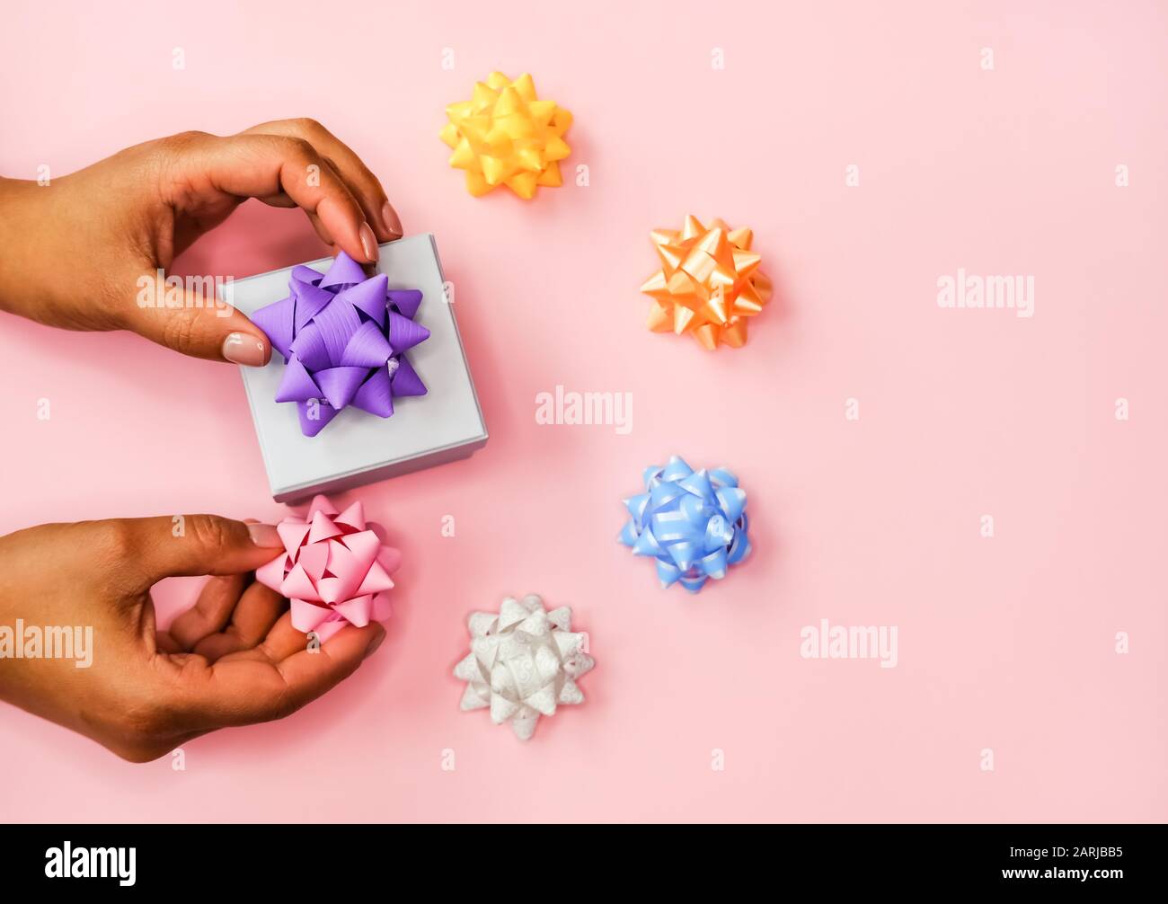 Hands and gifts Stock Photo - Alamy