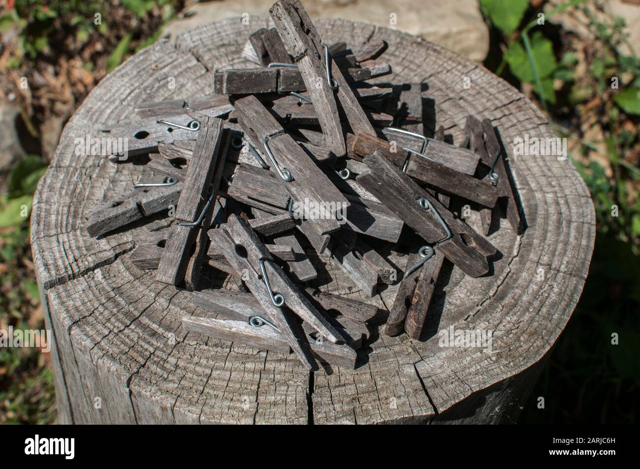 Pile of weathered wooden laundry clamps closeup Stock Photo - Alamy