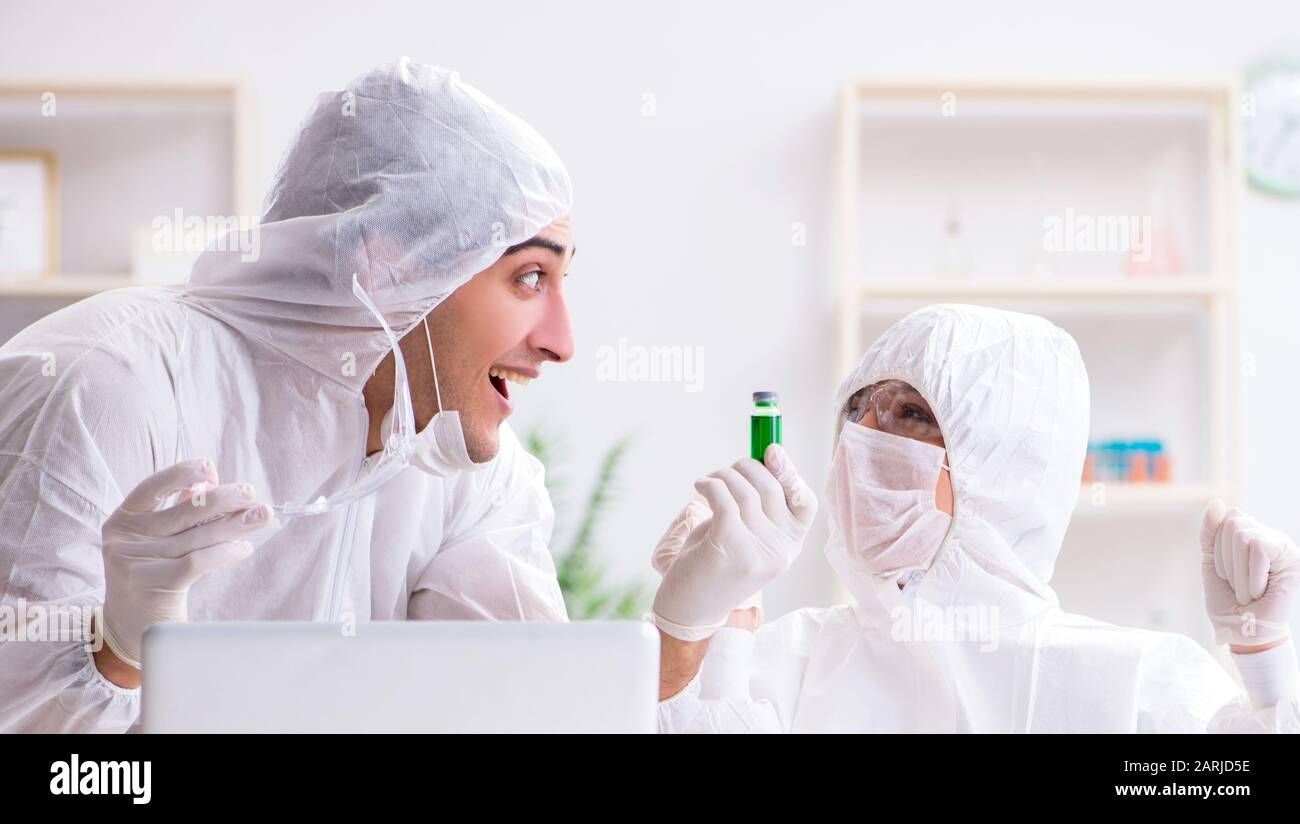 Two chemists working in the lab Stock Photo - Alamy