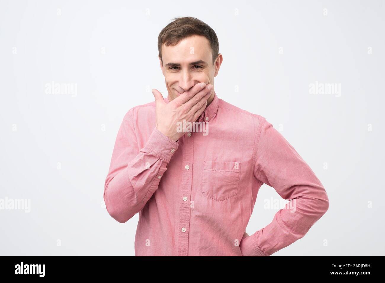 Ridiculously funny prices. Cheerful caucasian man laughing and covering ...