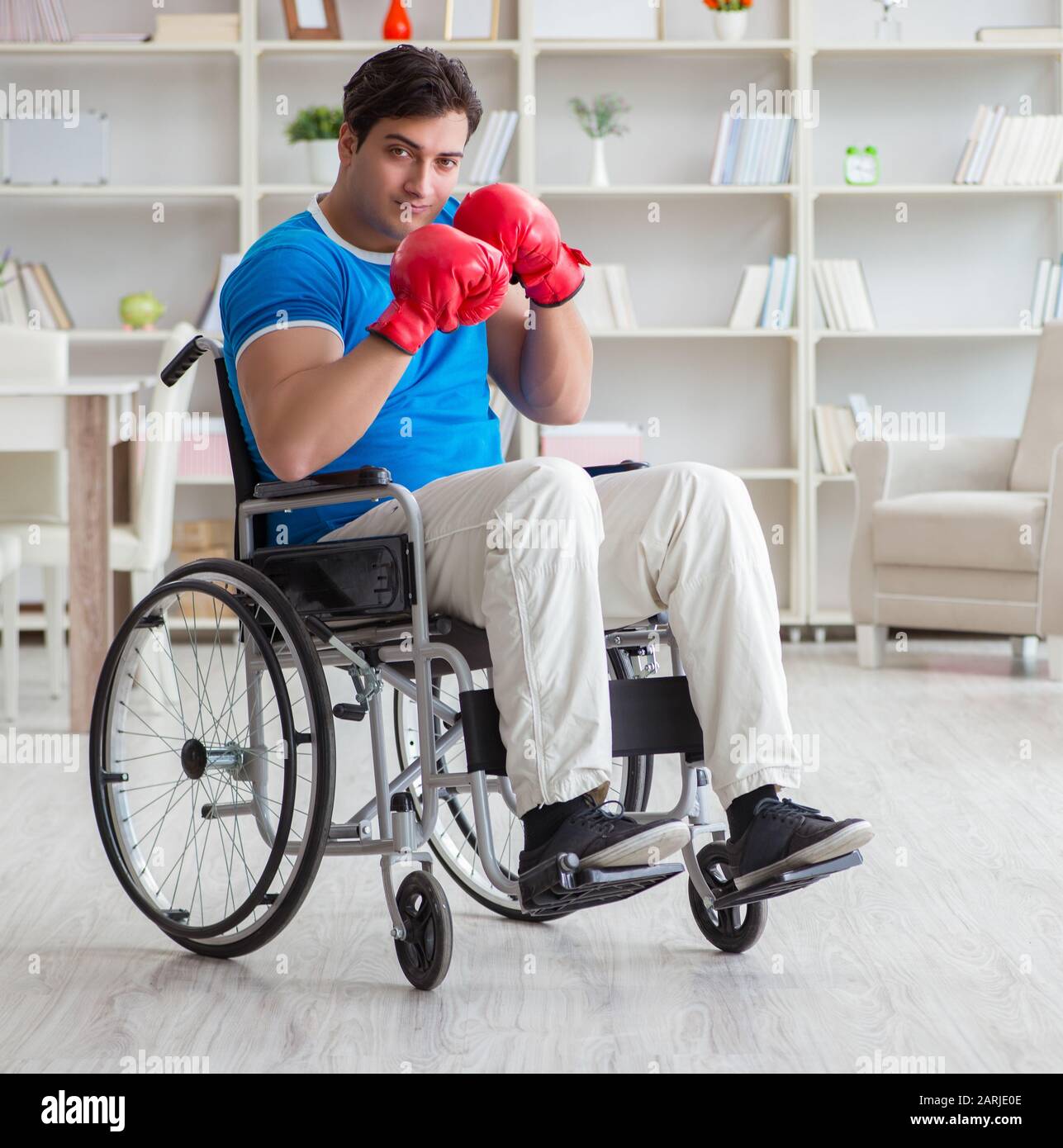 The disabled boxer at wheelchair recovering from injury Stock Photo - Alamy