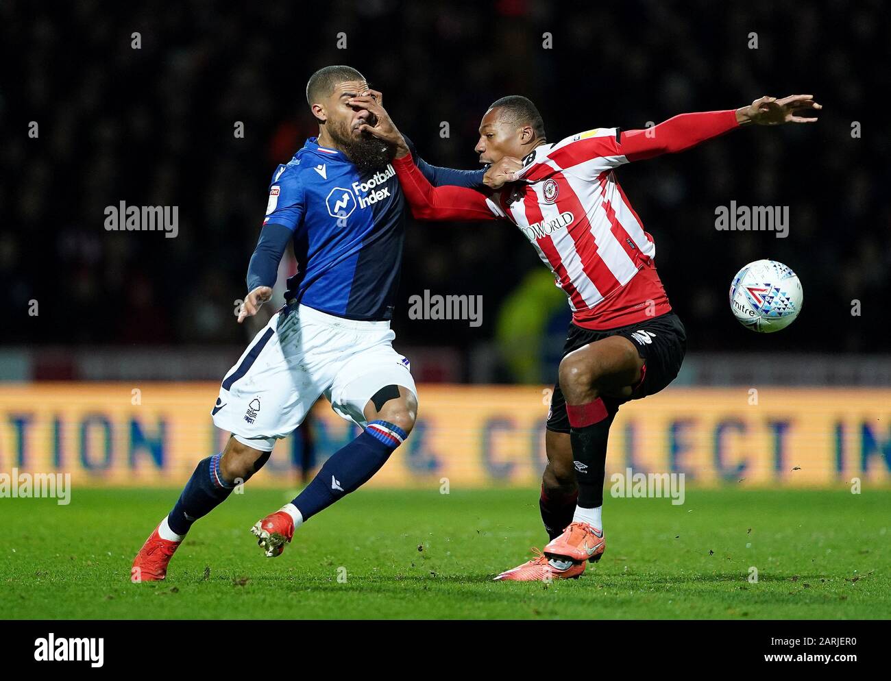 Nottingham Forest's Lewis Grabban (left) is fouled by Brentford's Ethan ...