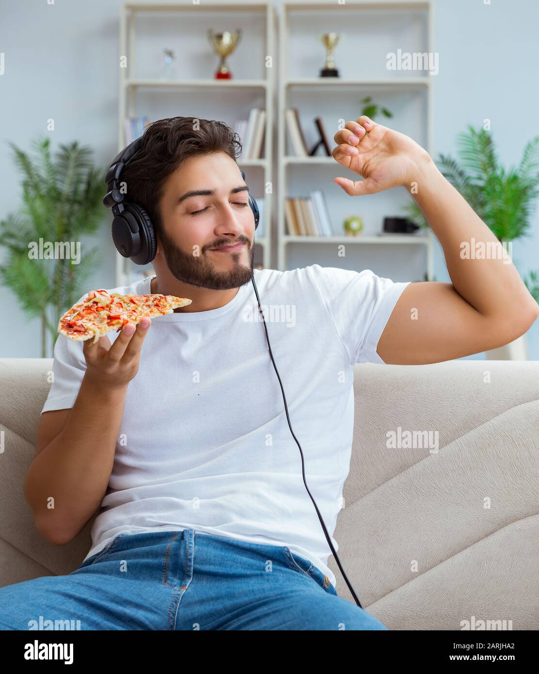 The man eating pizza having a takeaway at home relaxing resting Stock ...