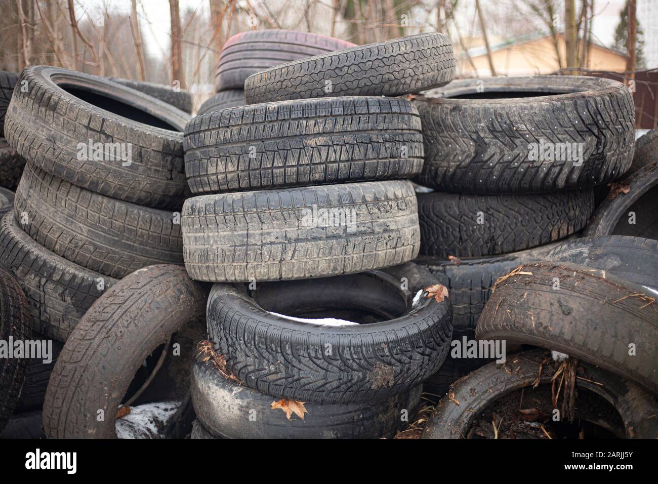 Rubber tires in a landfill. Old wheels from cars. Recycling rubber ...