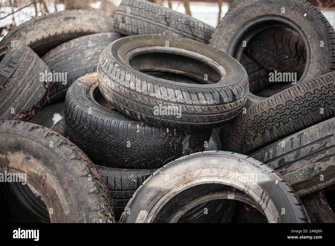 Rubber tires in a landfill. Old wheels from cars. Recycling rubber ...