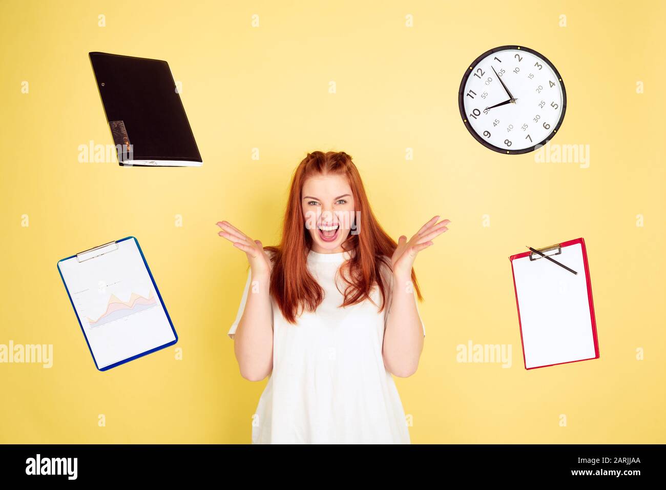 Screaming shocked. Caucasian young woman's portrait on yellow studio ...