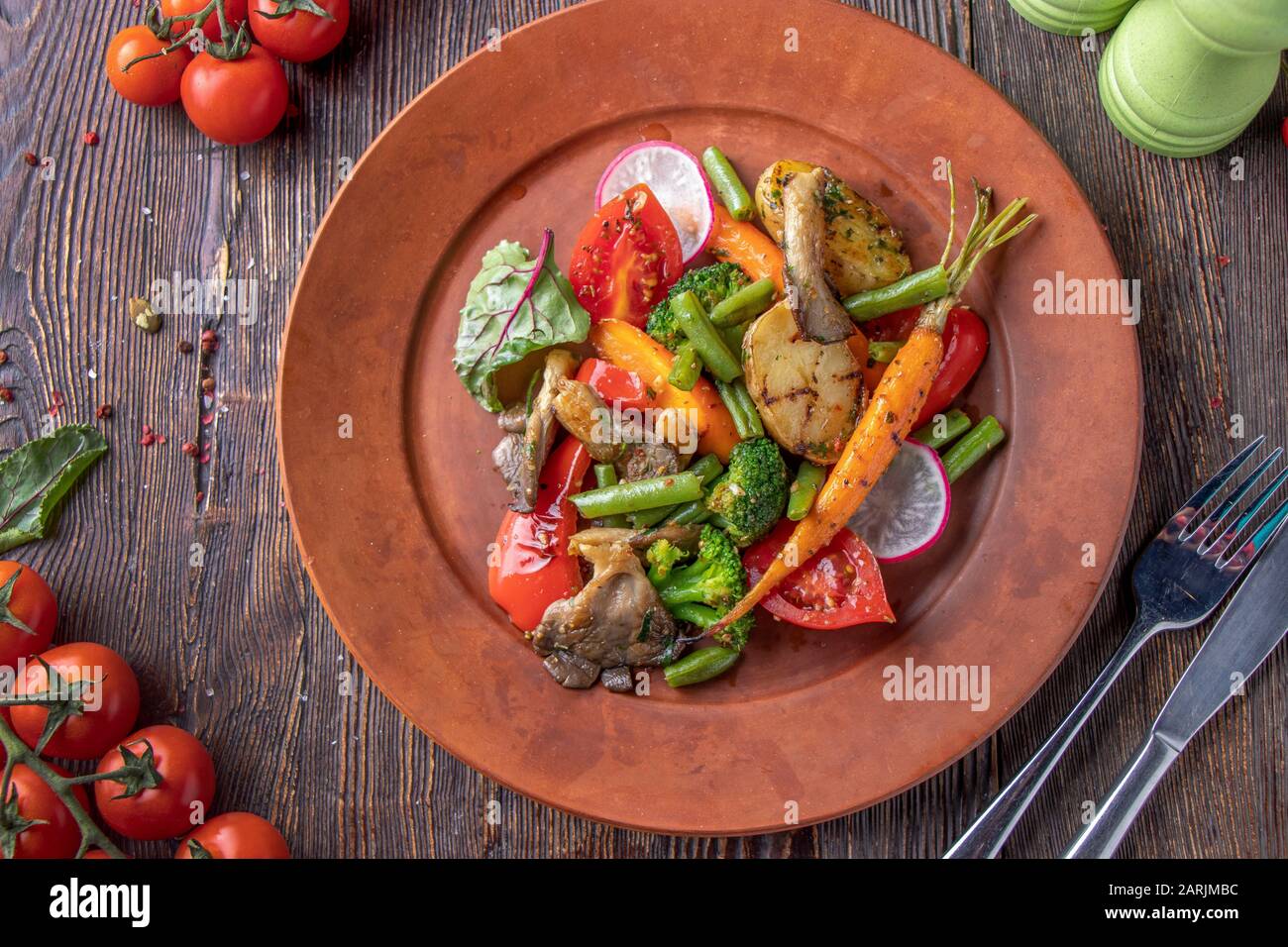 Vegetarian food, side dish of baked vegetables and mushrooms ...