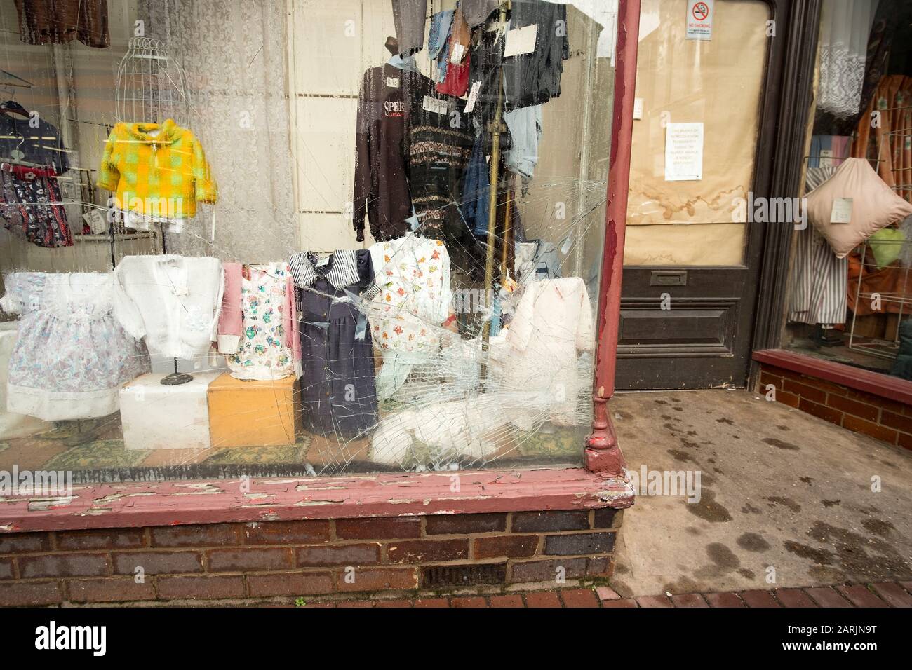 Smashed window of an old shop Stock Photo - Alamy