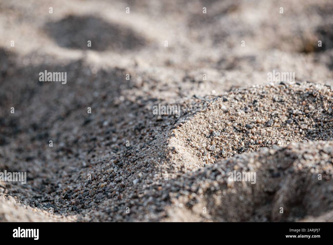 Sand furrows create a marco landscape Stock Photo - Alamy