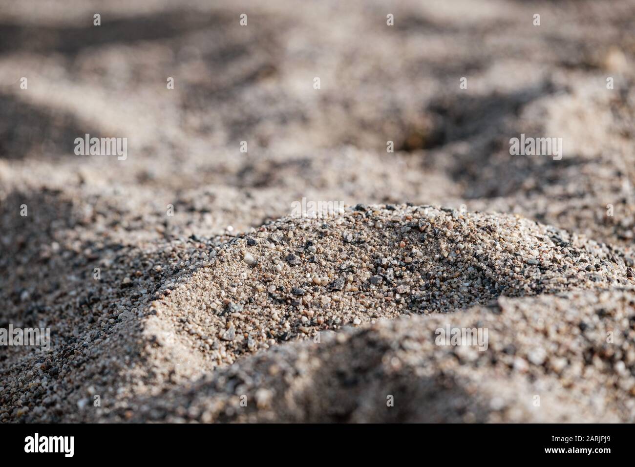 Sand furrows create a marco landscape Stock Photo - Alamy