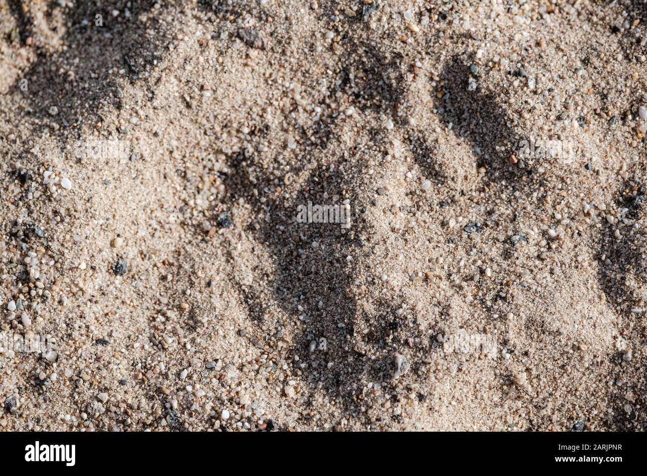 Sand furrows create a marco landscape Stock Photo - Alamy