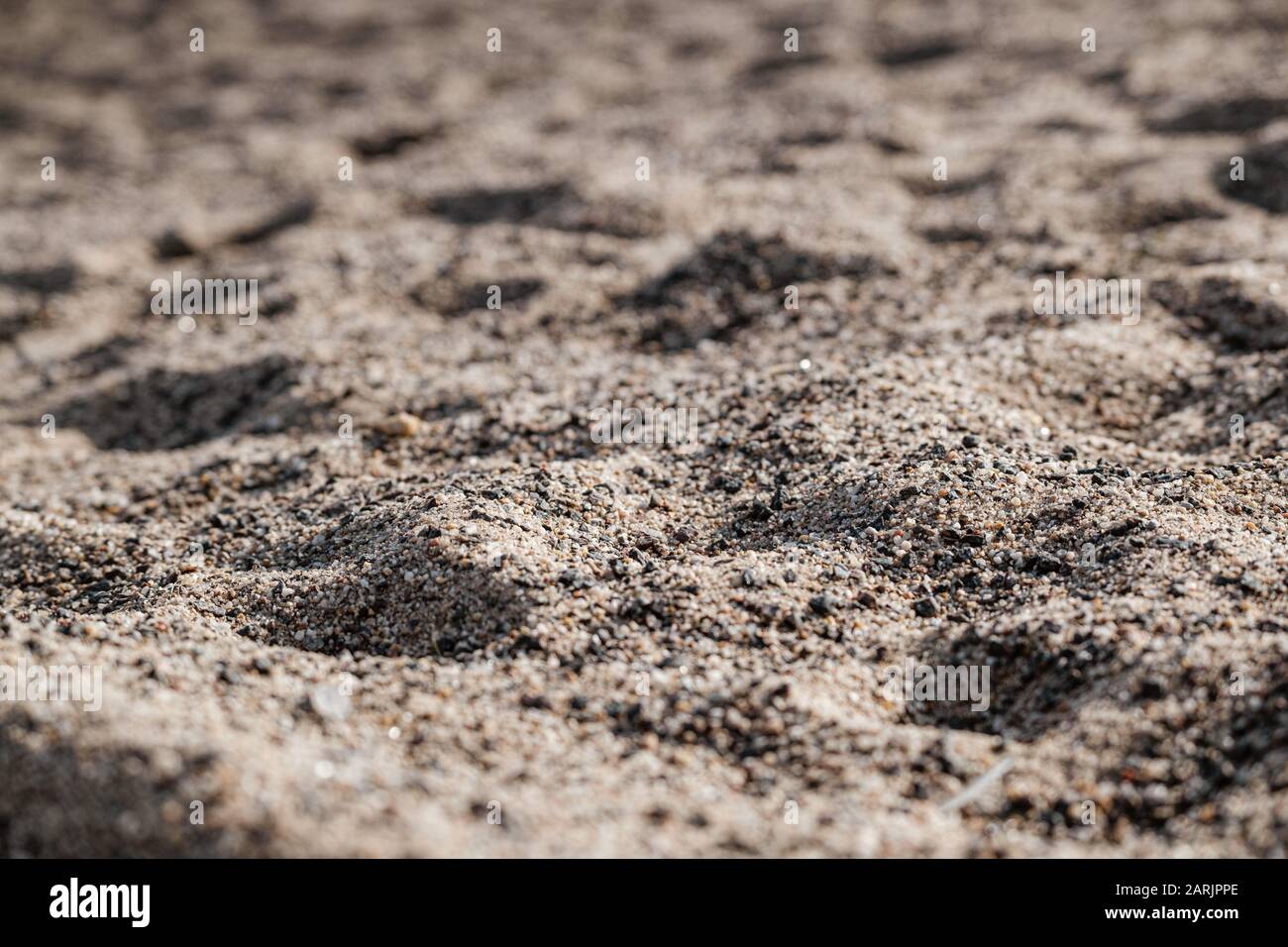 Sand furrows create a marco landscape Stock Photo - Alamy