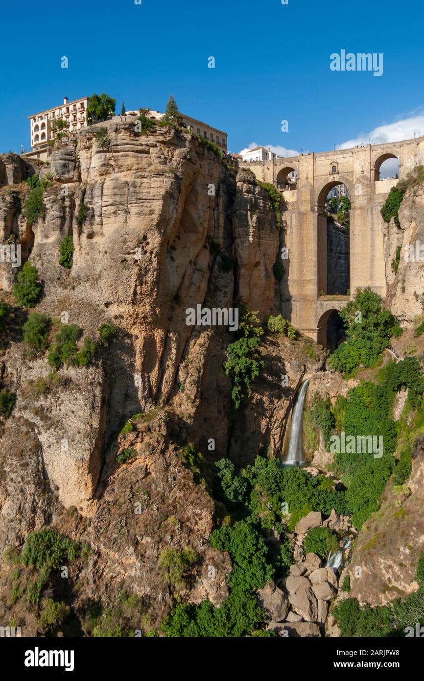 The New Bridge, the Parador, and waterfall of Ronda, Spain, a famous ...