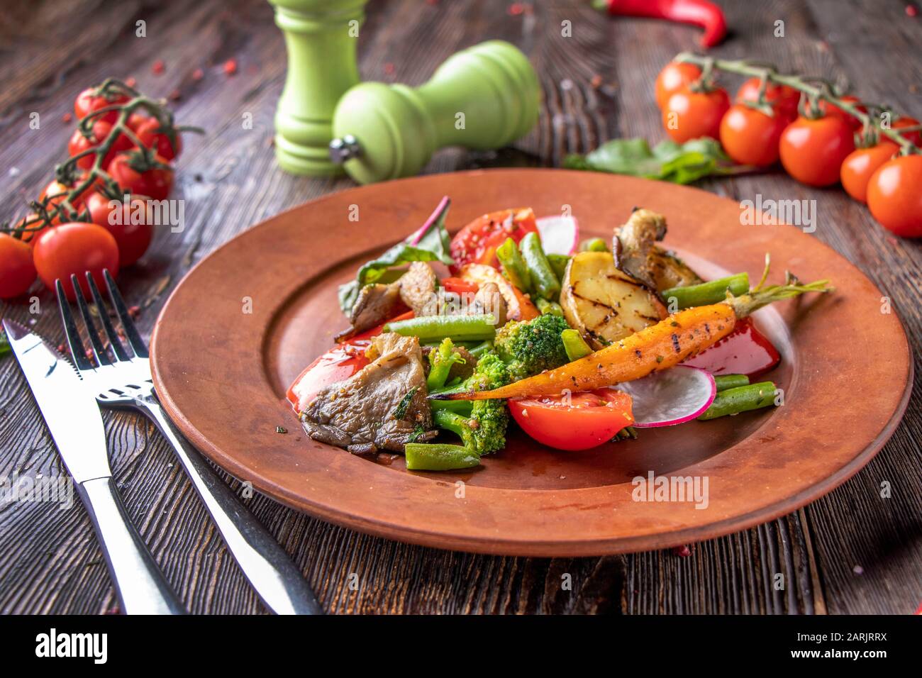 Vegetarian food, side dish of baked vegetables and mushrooms ...