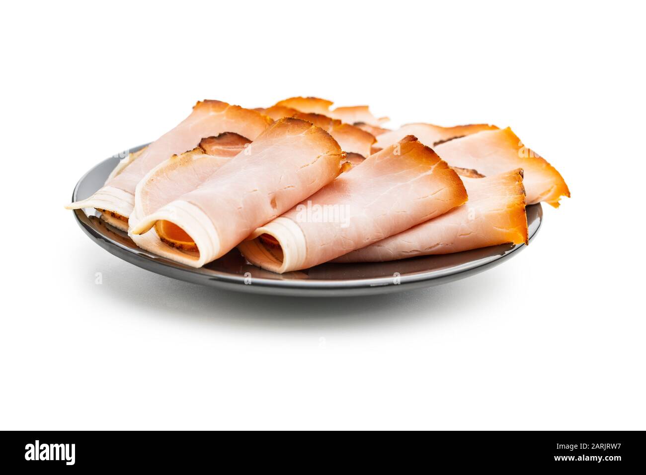 Sliced smoked ham on plate. Tasty pork meat isolated on white ...
