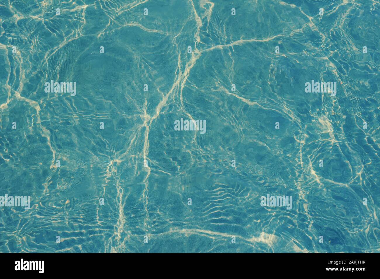 transparent water ripple, sand waves and sunlight glare. sea floor ...