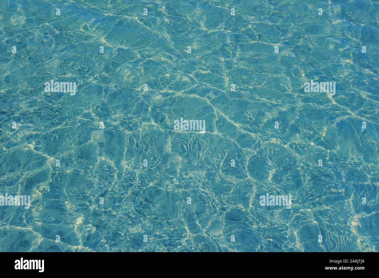 transparent water ripple, sand waves and sunlight glare. sea floor ...