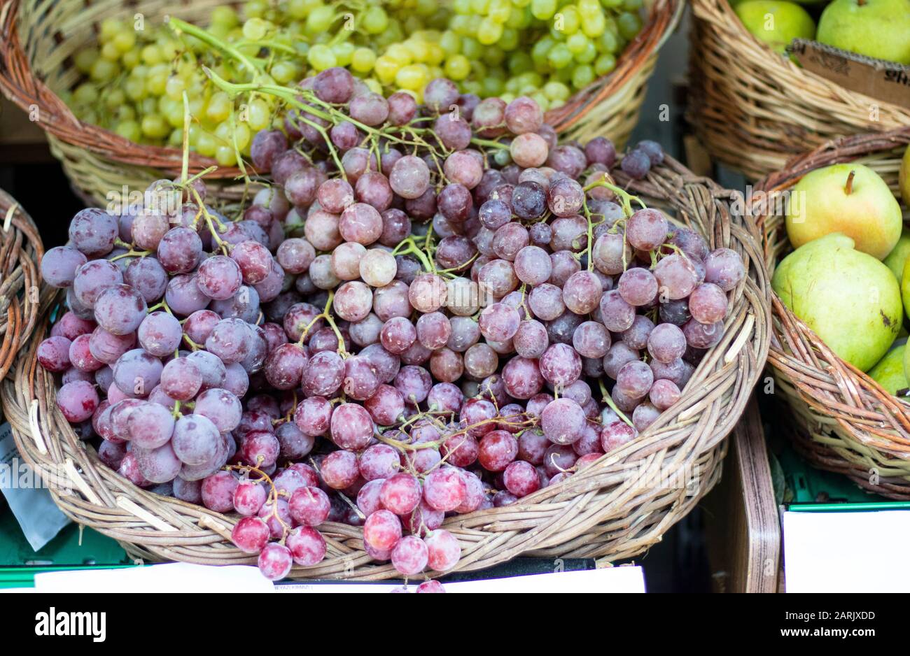 Fruit grape on the greengrocer counter. Bench on the pavement Stock ...