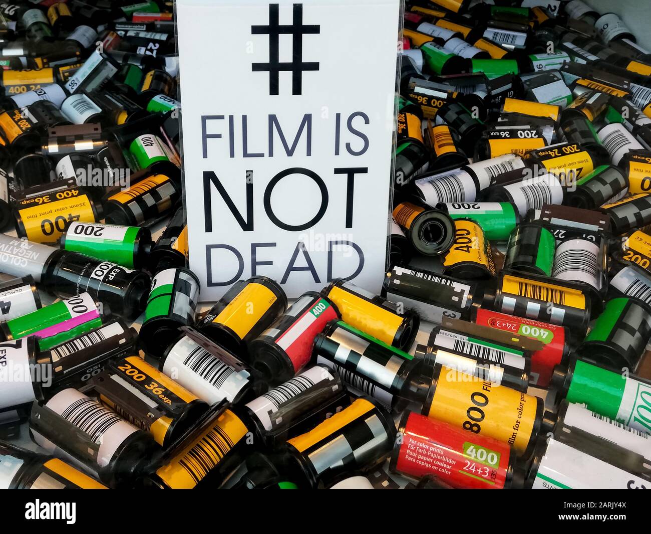 An old photo film rolls piled up with a sign that says "Film is not ...