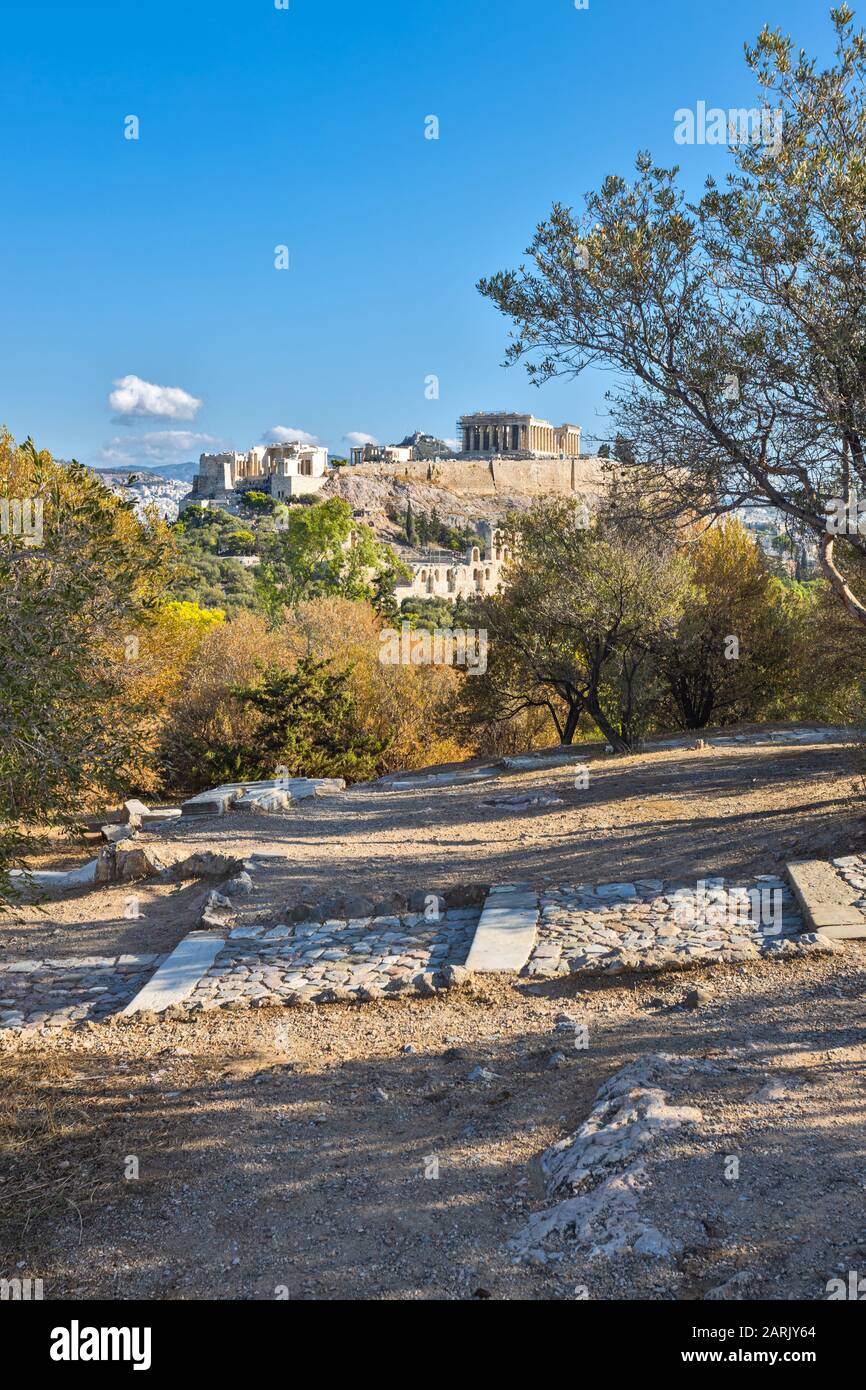 Ancient pavement on the path of Filopappou Hill in Athens and Acropolis ...