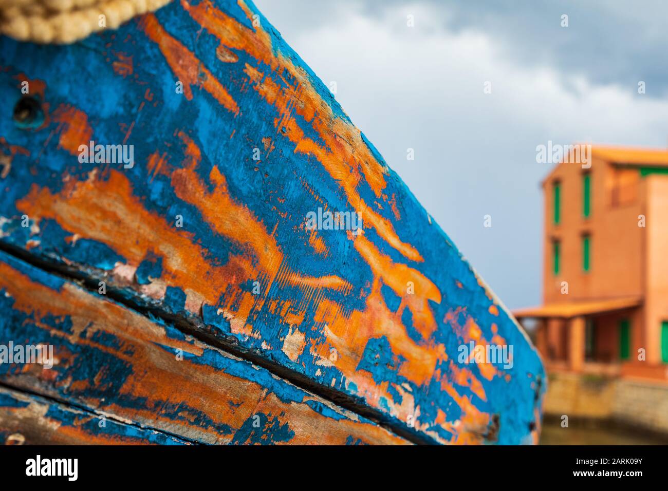 Italy, Sicily, Palermo, Santa Flavia. Peeling paint on a small wooden ...