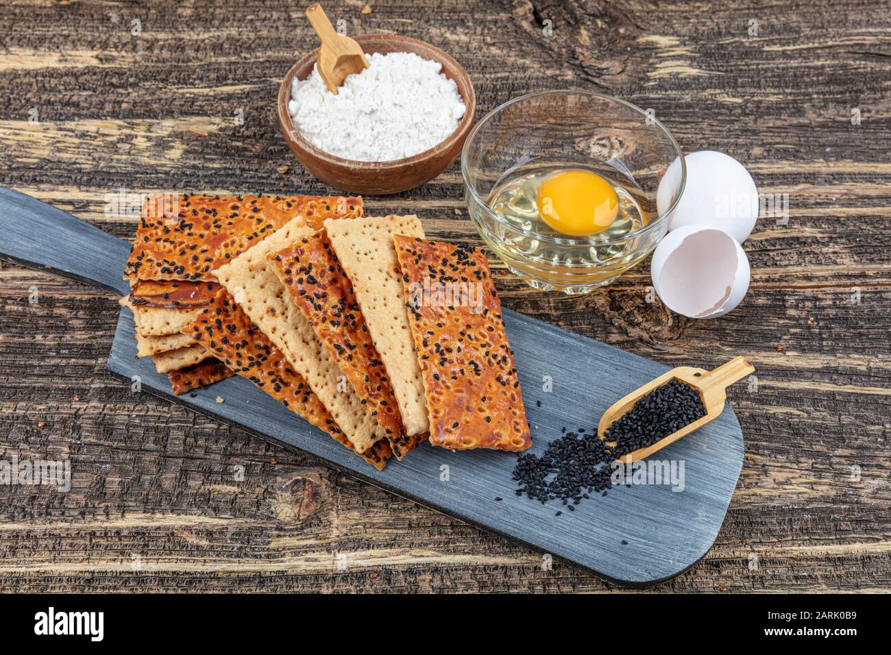 Black Seed Crunchy Crackers. Black seed crackers on wooden background ...