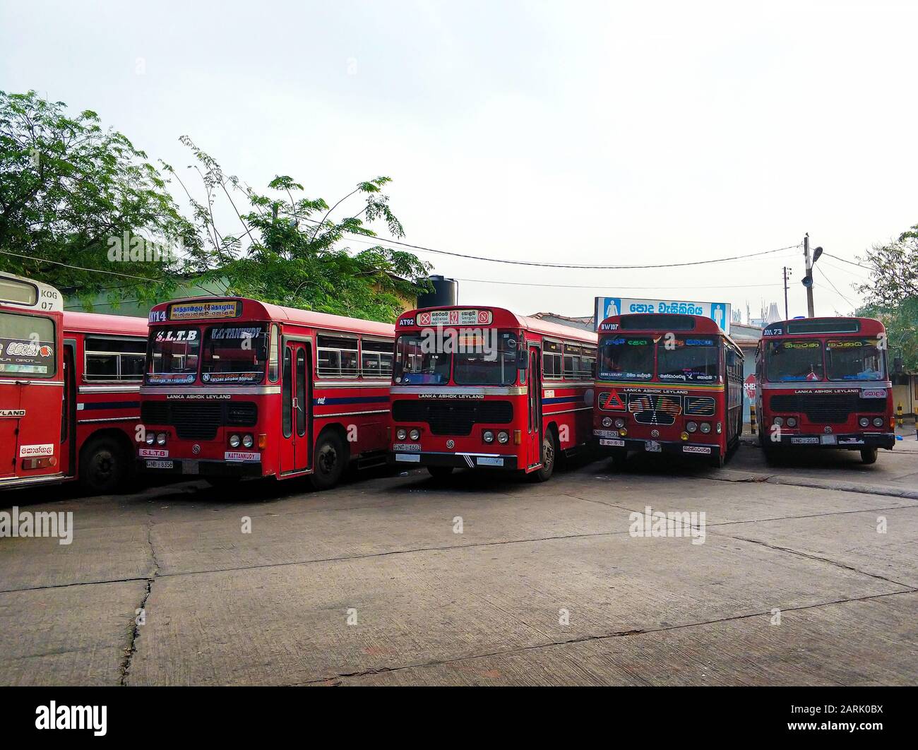 Bus station in Sri Lanka. Parking old red buses Stock Photo - Alamy