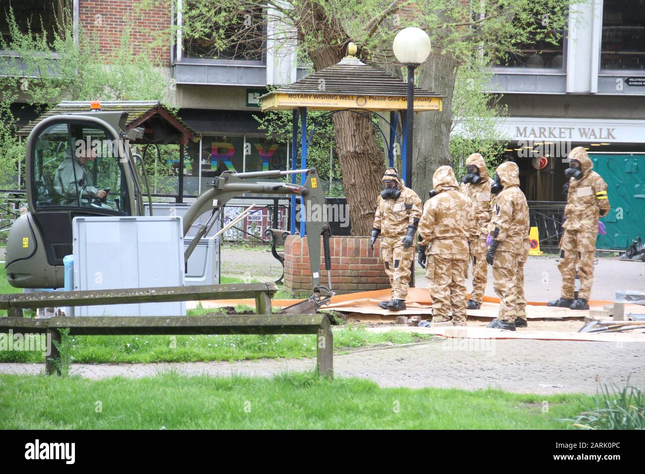 Emergency services in hazmat suits removing the bench where former ...