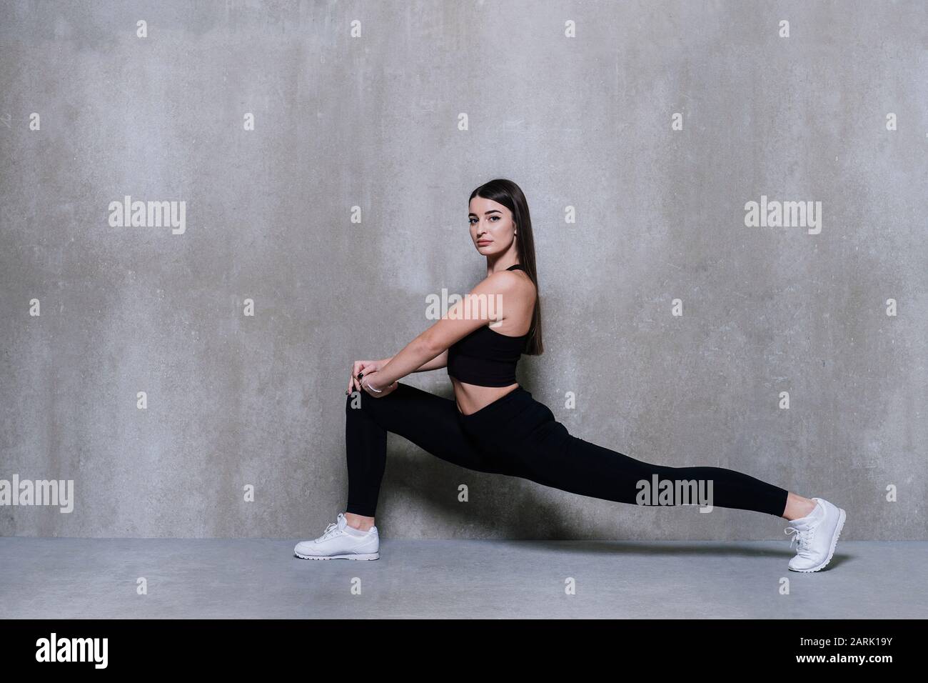 Fitness woman doing lunges exercises for leg muscle workout training ...