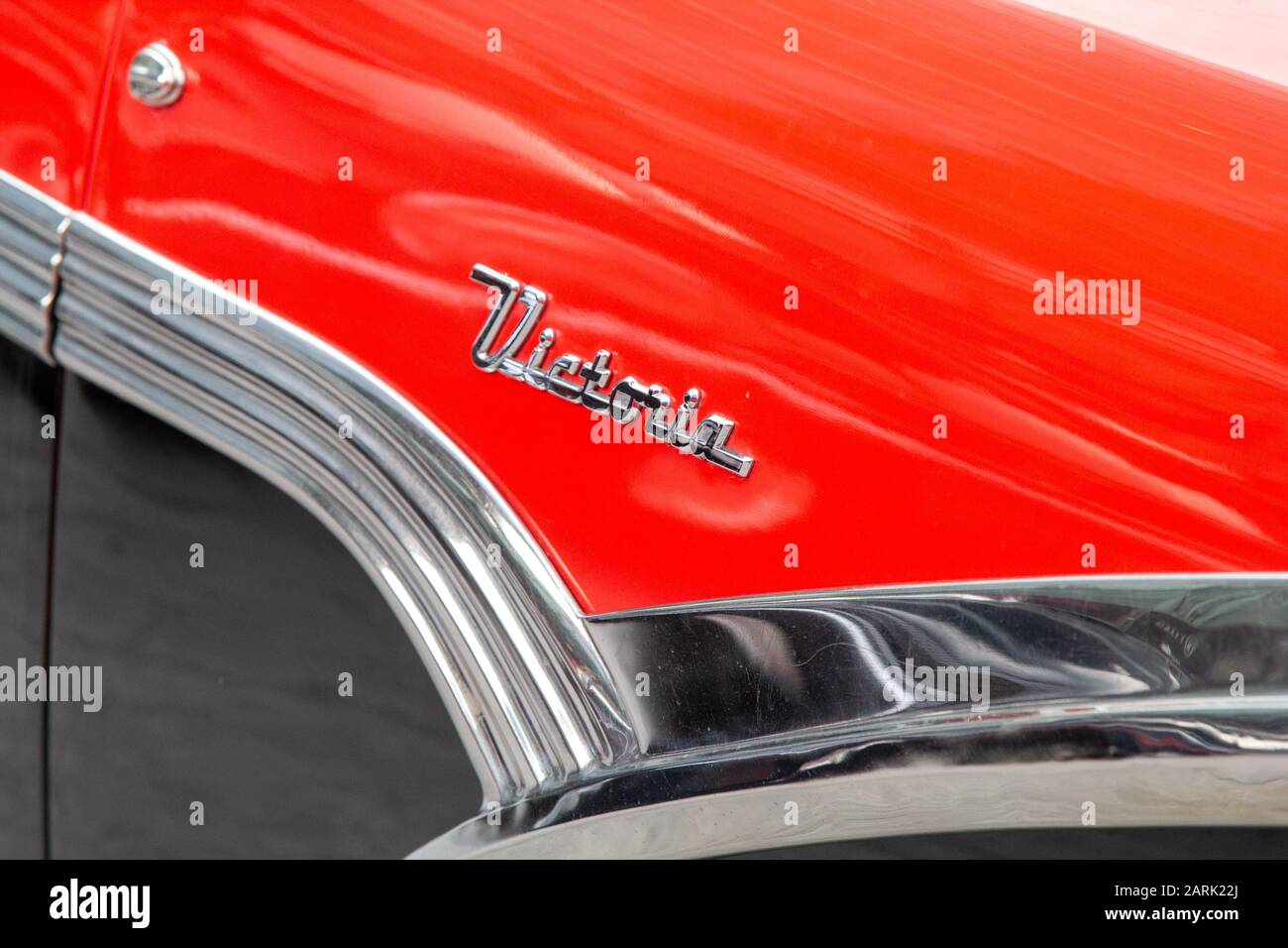 Nickel Victoria logo of red 1955 Ford Fairlane Stock Photo - Alamy