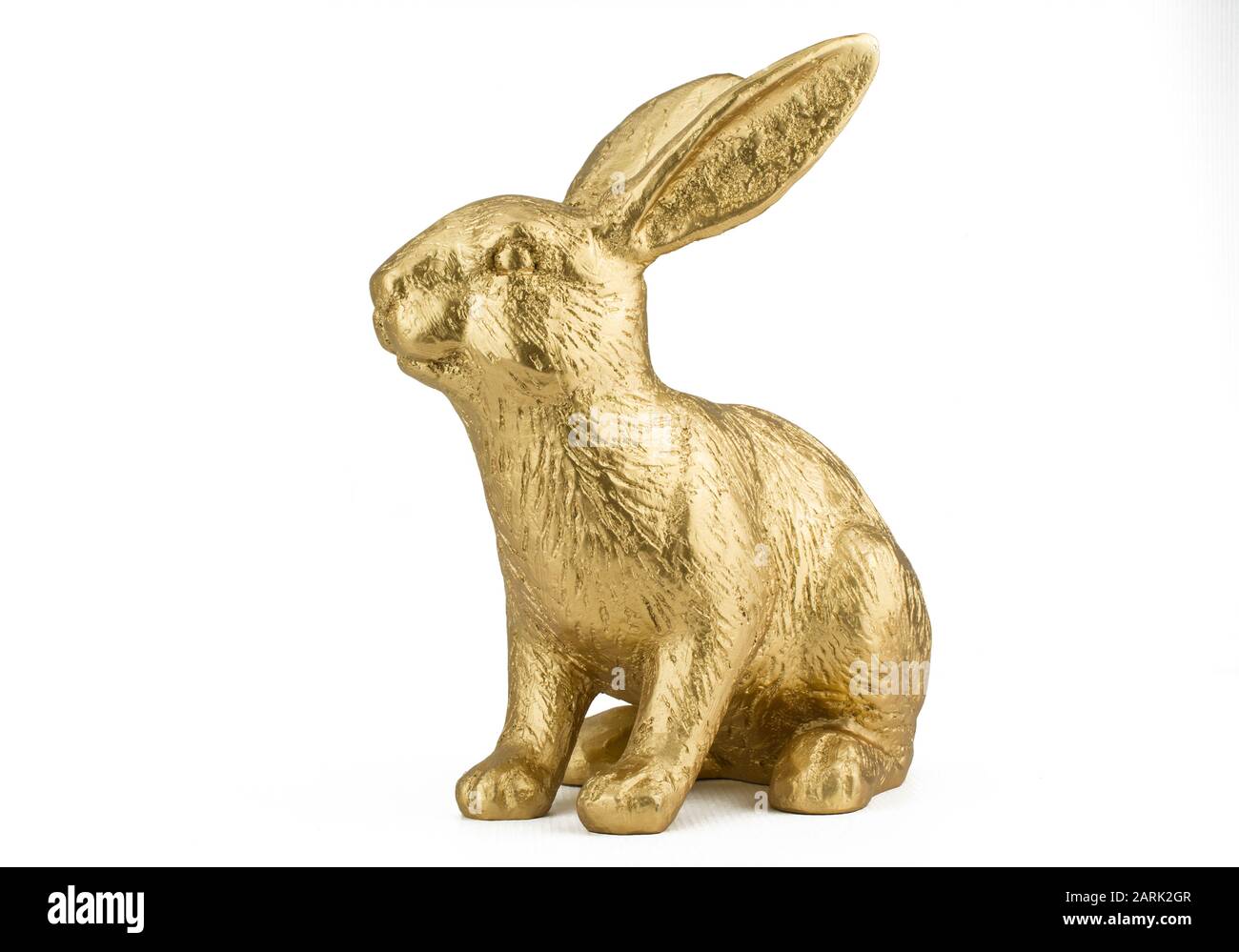 gold rabbit on white background Stock Photo - Alamy