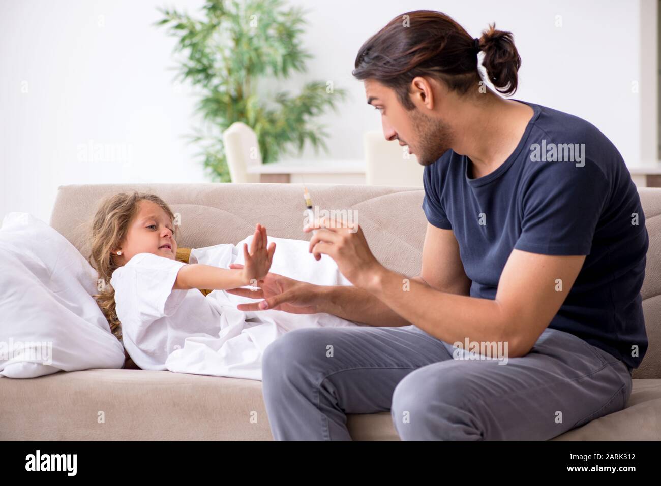 The father taking care of his ill daughter Stock Photo - Alamy