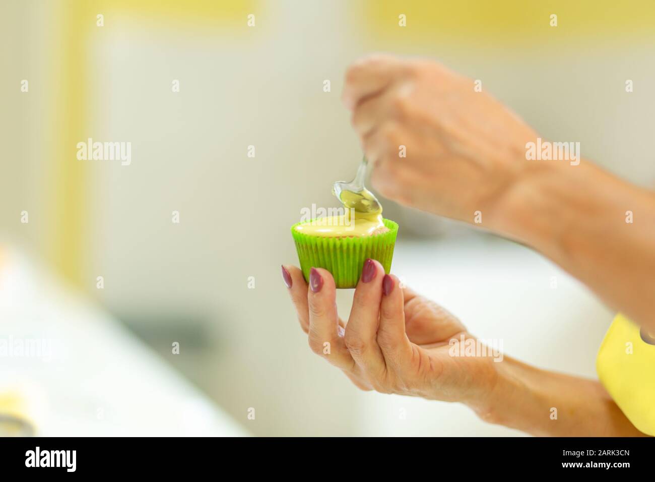 The process of making cupcakes. Creation of cakes by professional ...