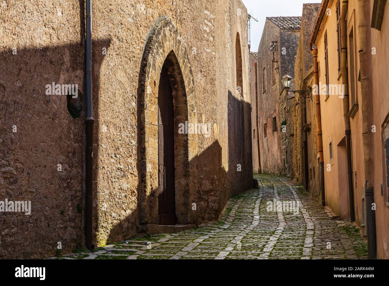 Italy, Sicily, Trapani Province, Erice. A narrow cobblestone street in ...