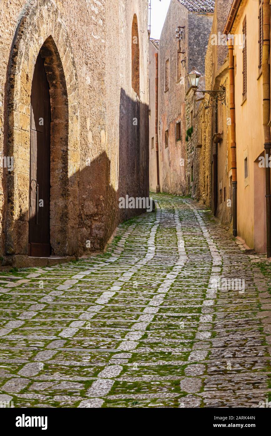Italy, Sicily, Trapani Province, Erice. A narrow cobblestone street in ...