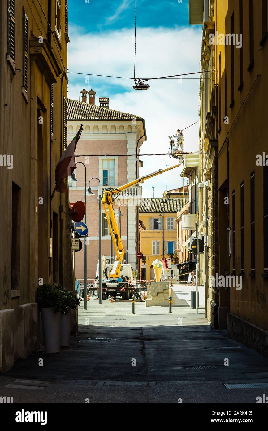 RAVENNA, ITALY - MAY 2, 2019: workers cleaning ancient building from a ...