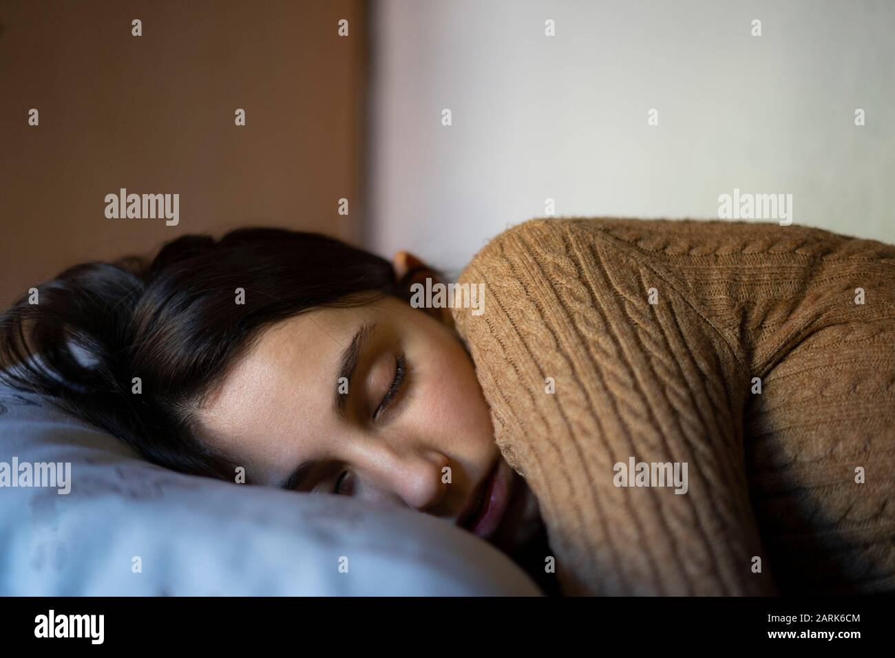 Young girl dressed in brown napping. Nap and sleep concept Stock Photo - Alamy