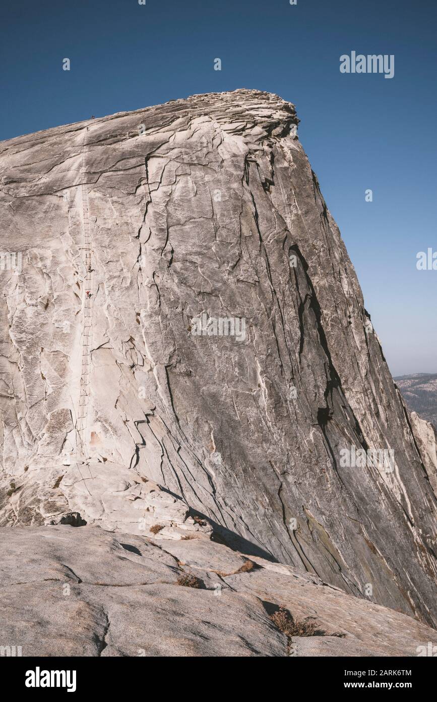 Climbers ascending cable secured section of Half Dome in Yosemite NP ...
