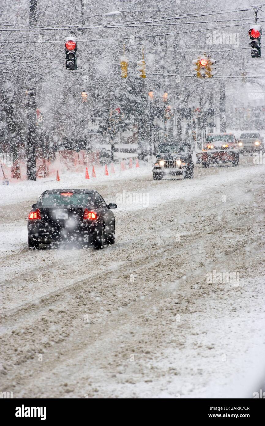 New England blizzard conditions on a crowded suburban road Stock Photo ...