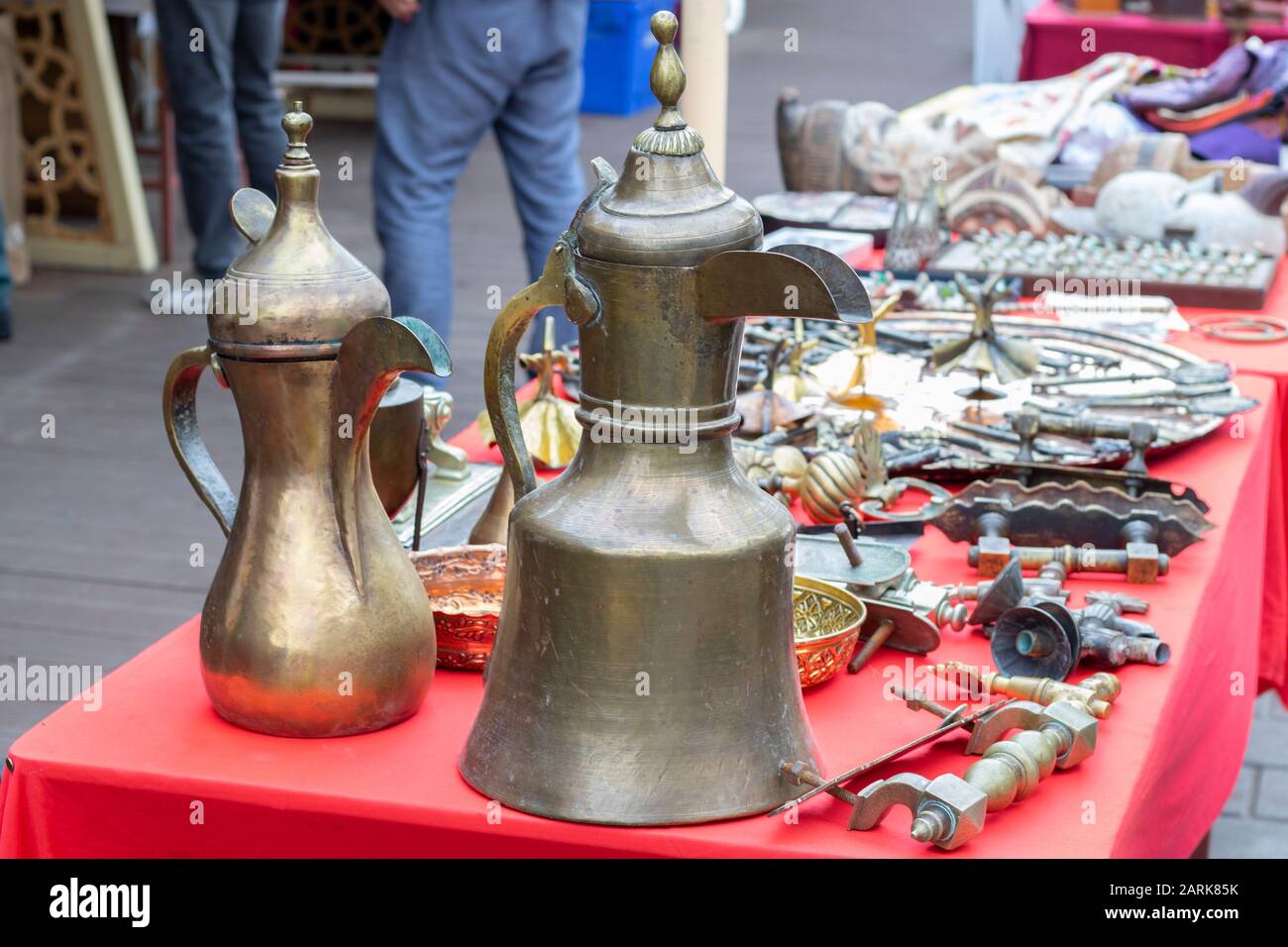 Old historical used items. Metallic kitchenware. Photographed outside ...