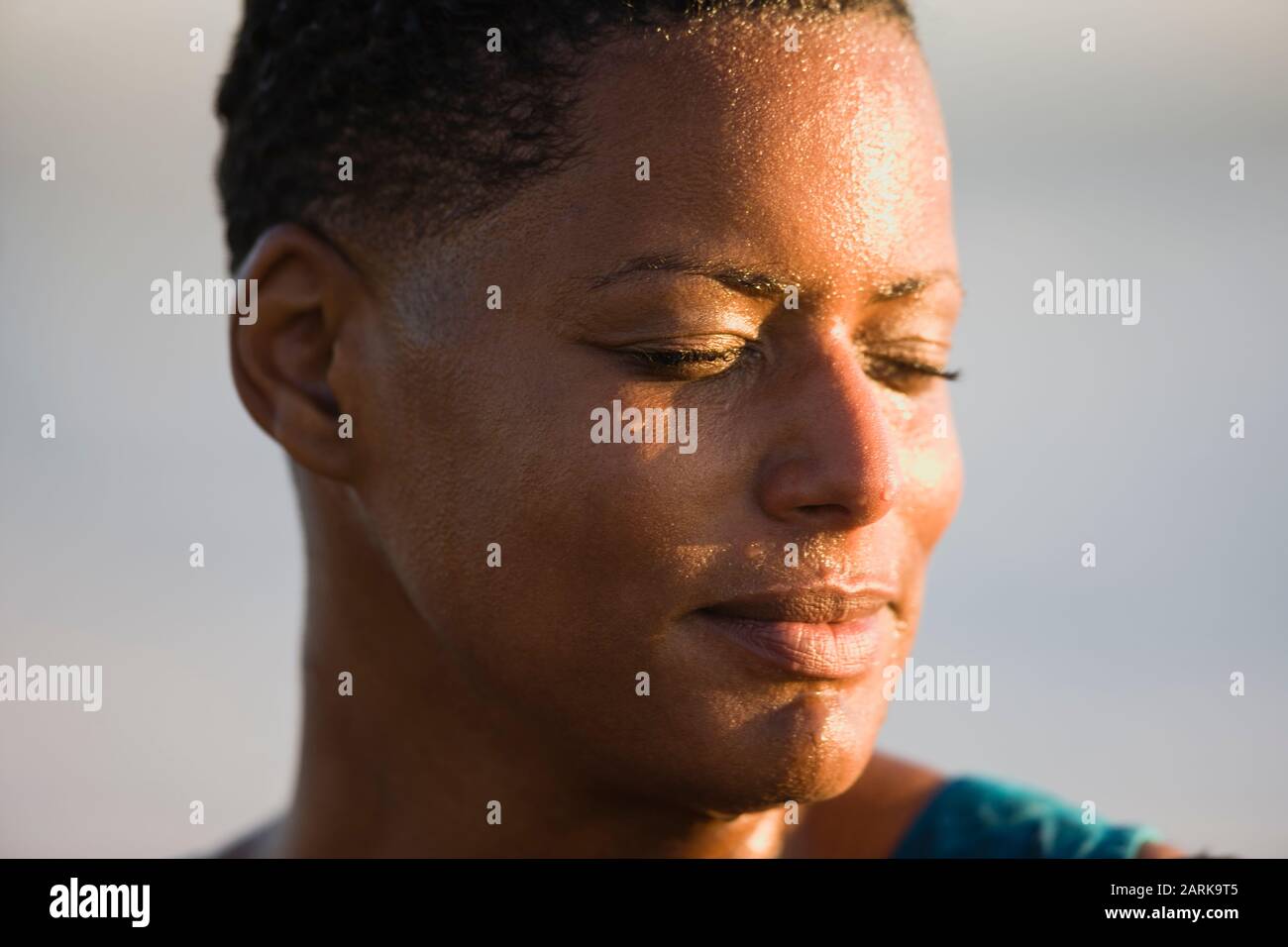 Woman's wet face after a swim Stock Photo - Alamy