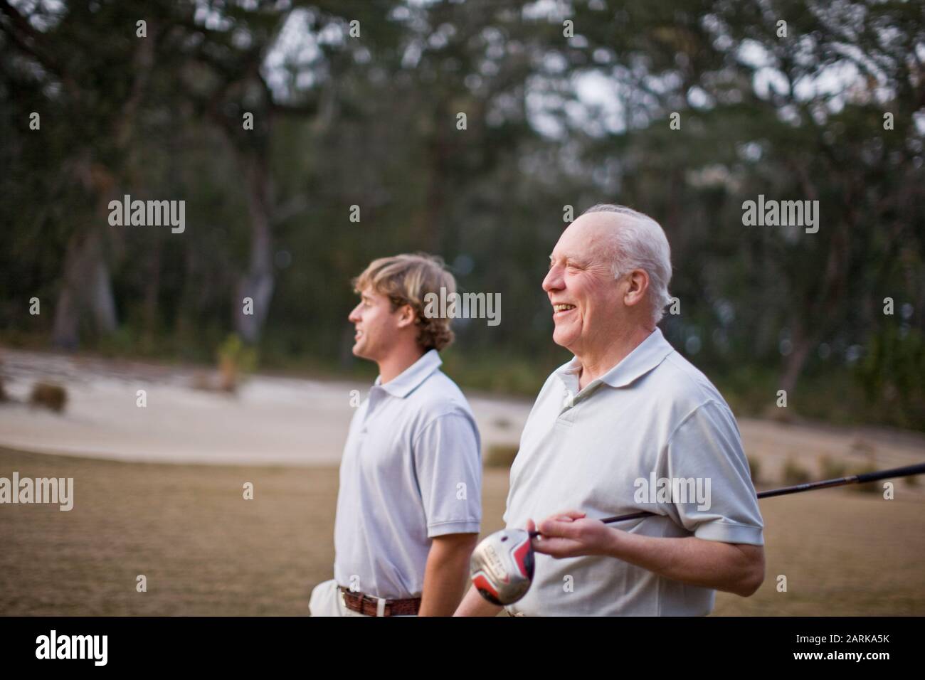 Father and adult son playing golf Stock Photo - Alamy