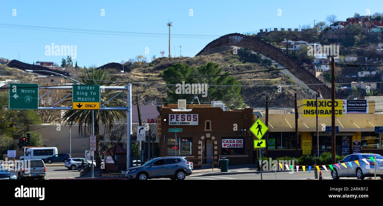 A view of downtown Nogales, AZ, with storefronts in foreground and ...